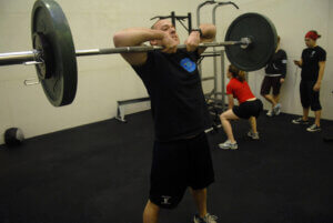 How to do Sumo Deadlift High Pull - Strengthguides.com